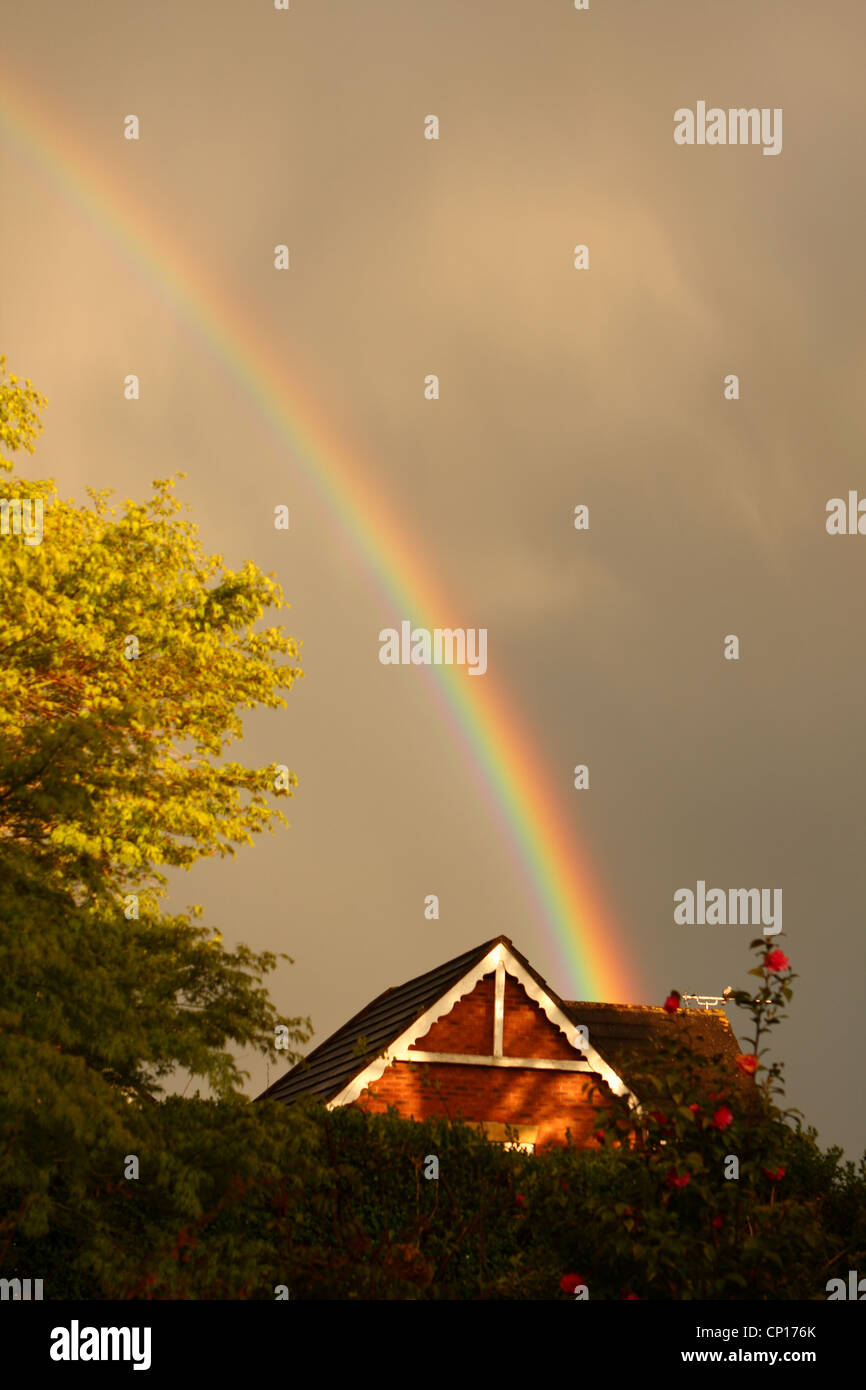 a rainbow over a house Stock Photo - Alamy