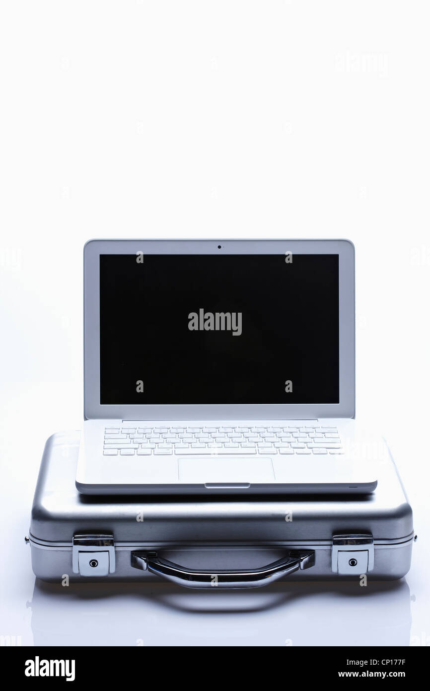 Laptop on the briefcase Stock Photo - Alamy