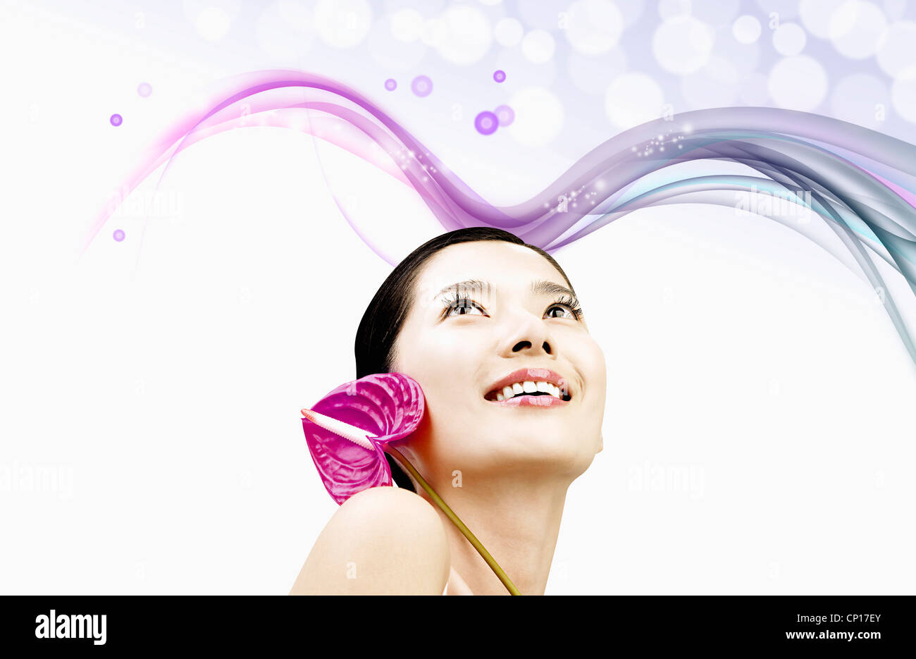 A woman with purple flower Stock Photo - Alamy