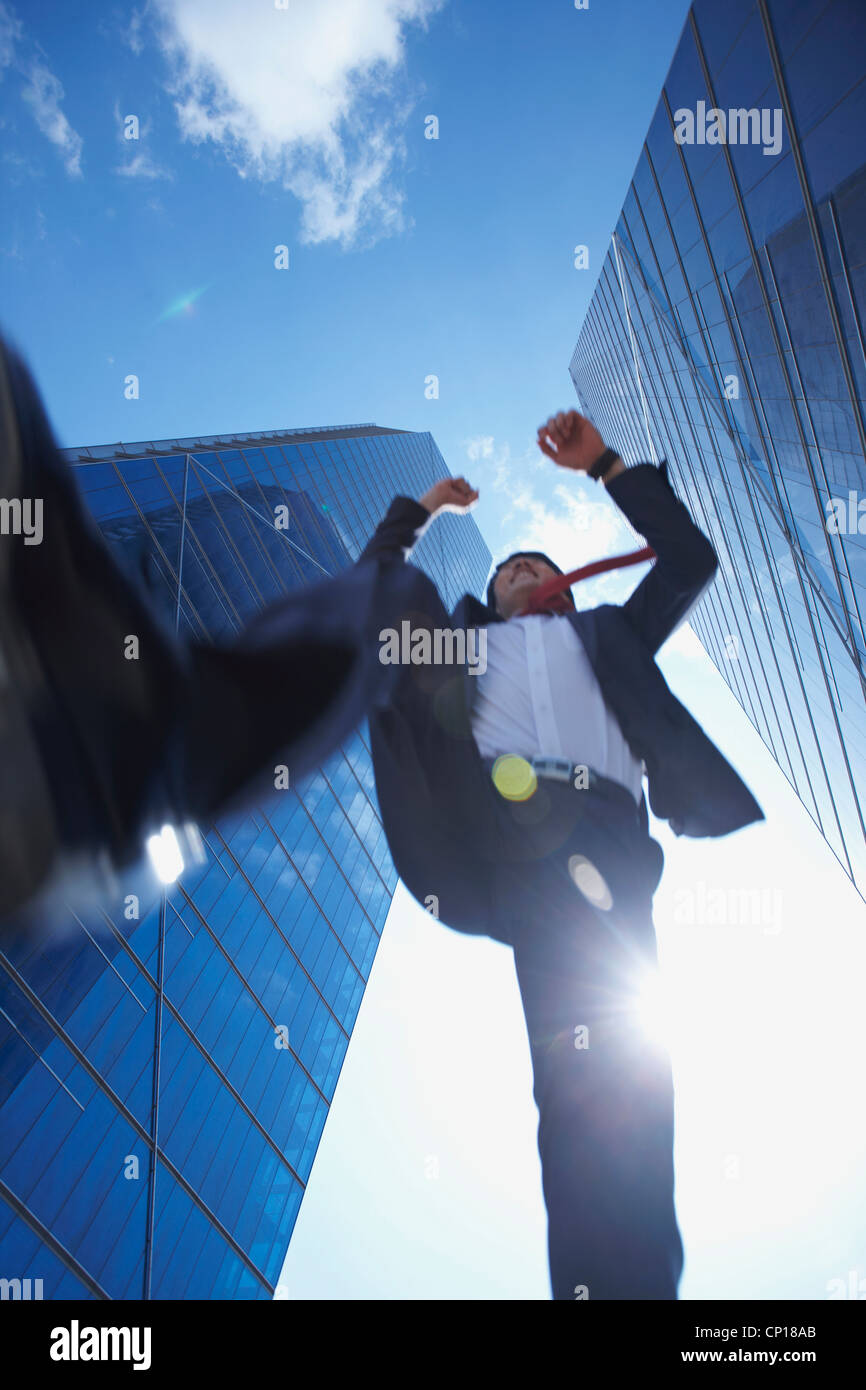 A man jumping around the buildings Stock Photo - Alamy