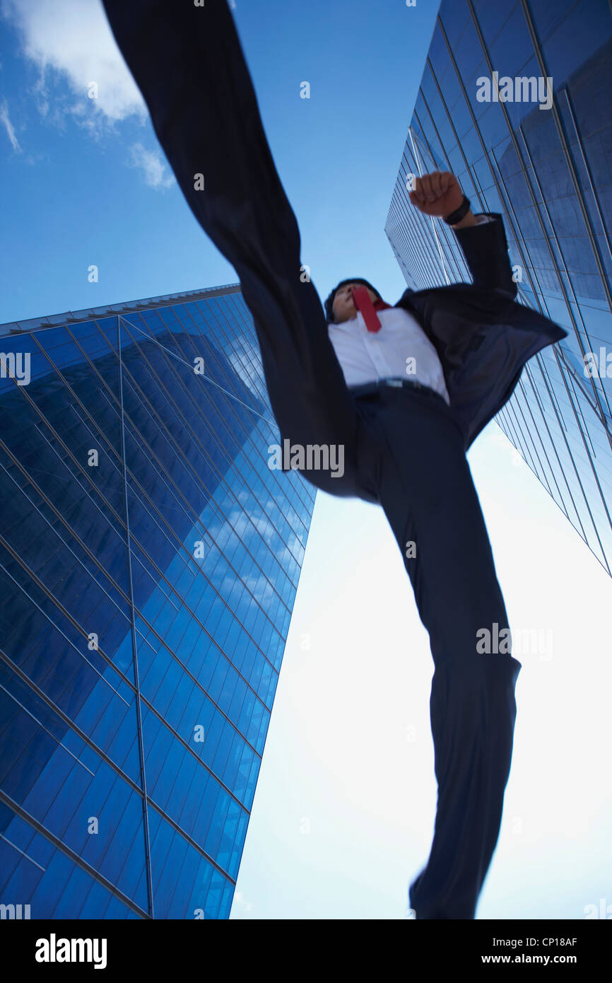 A man jumping around the buildings Stock Photo - Alamy