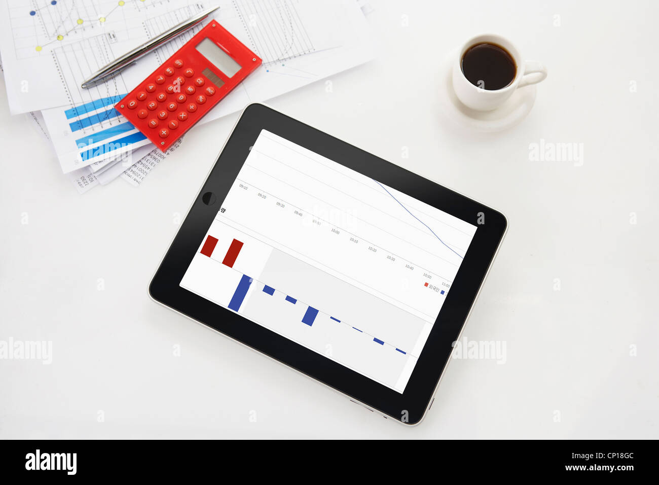 A tablet PC showing the chart on the office desk Stock Photo - Alamy