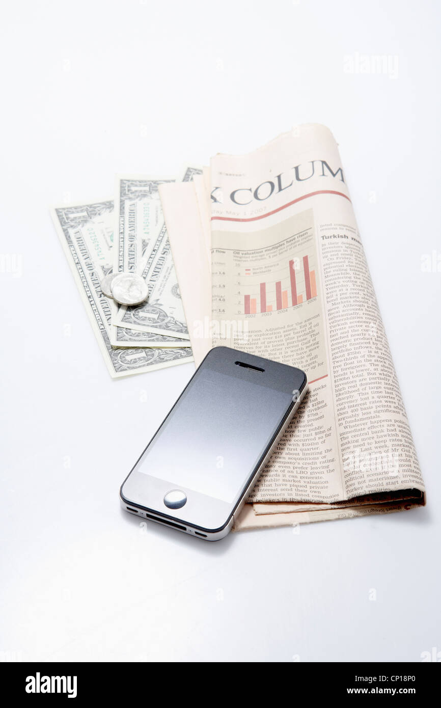 A smart phone, the newspaper, the money Stock Photo - Alamy