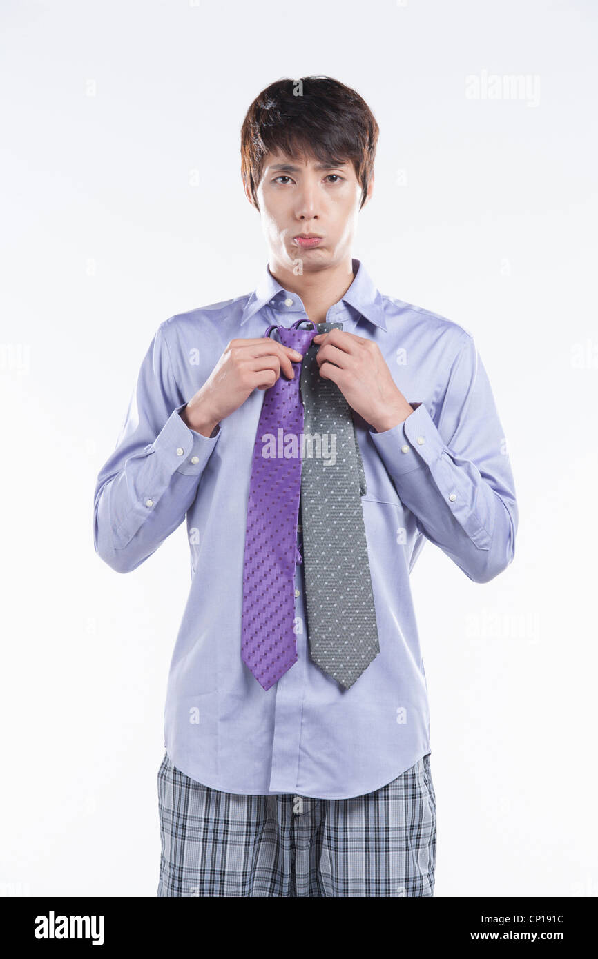 A man trying on tie Stock Photo - Alamy