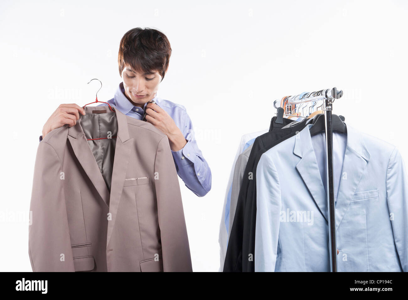 A man trying on the jacket Stock Photo - Alamy