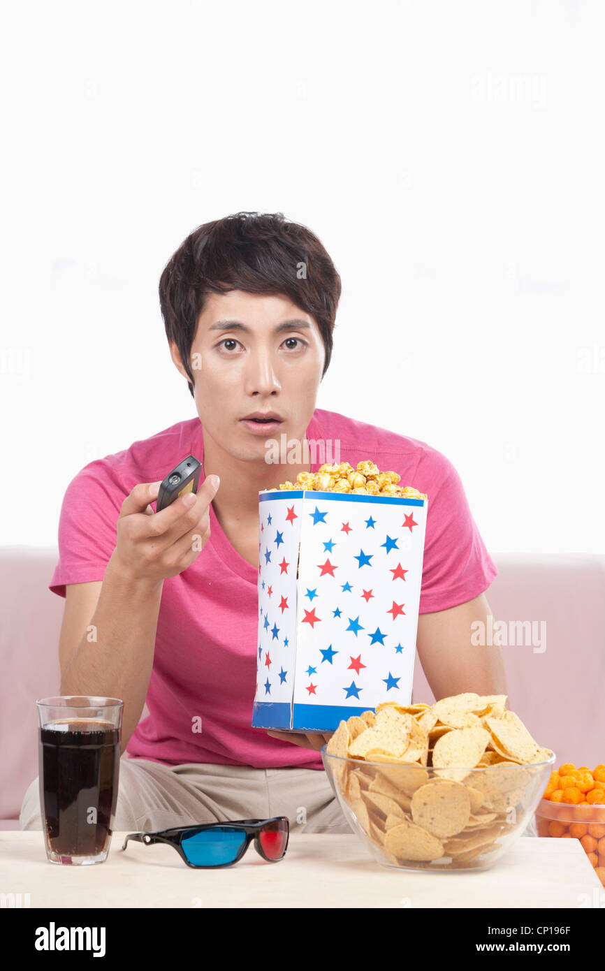 A man watching the movie with pop corn Stock Photo - Alamy
