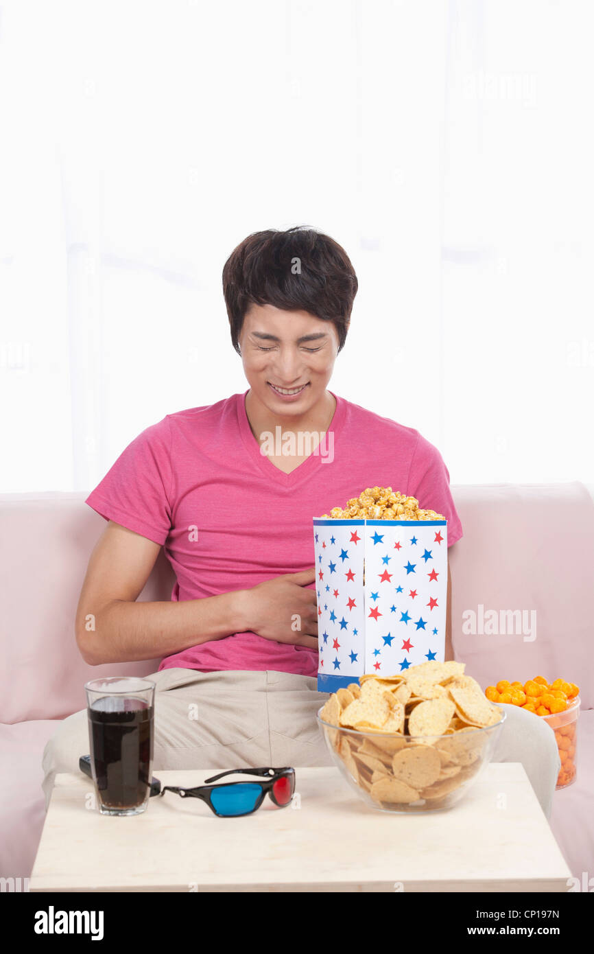 A man watching the movie with pop corn Stock Photo - Alamy