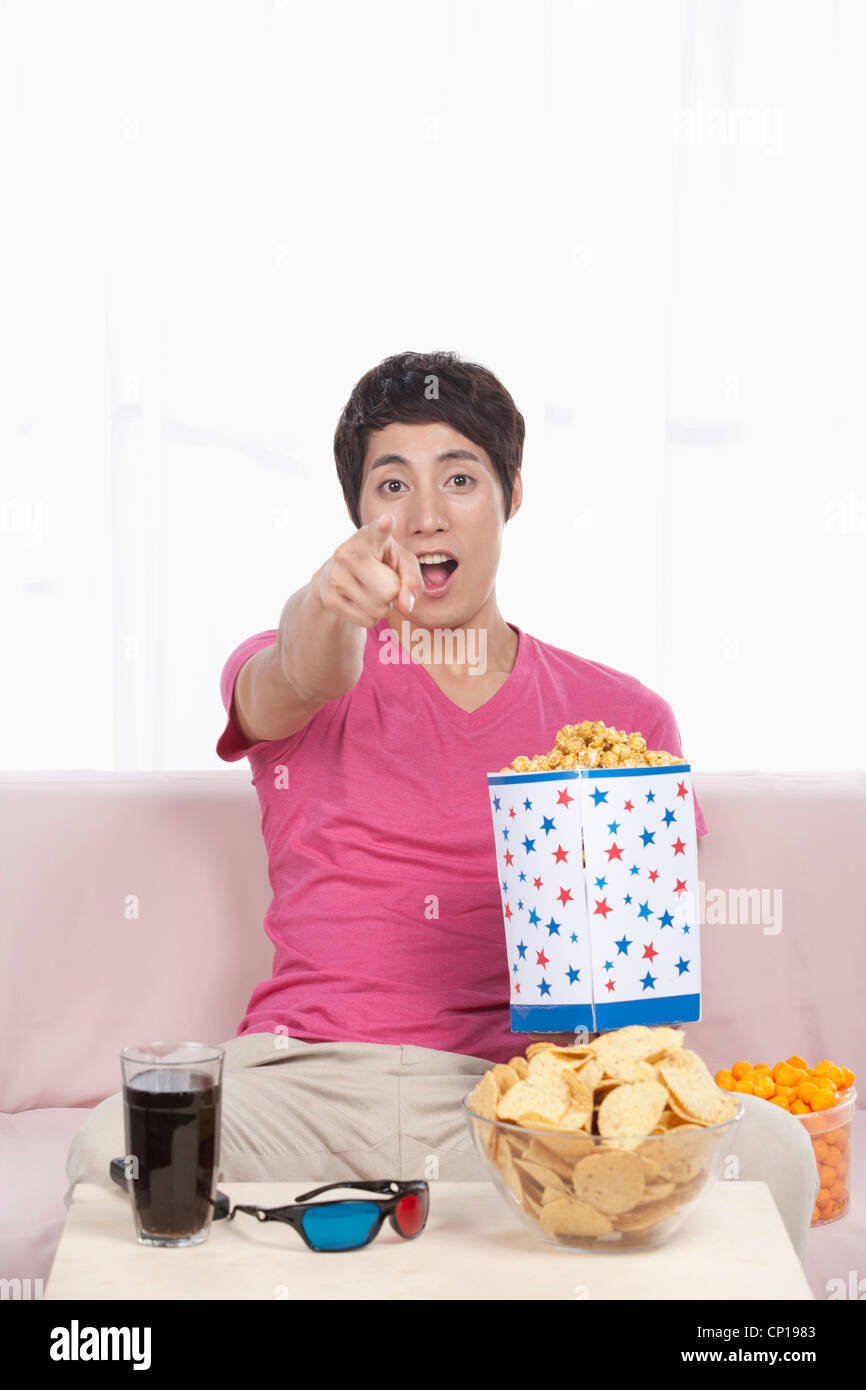 A man watching the movie with pop corn Stock Photo - Alamy