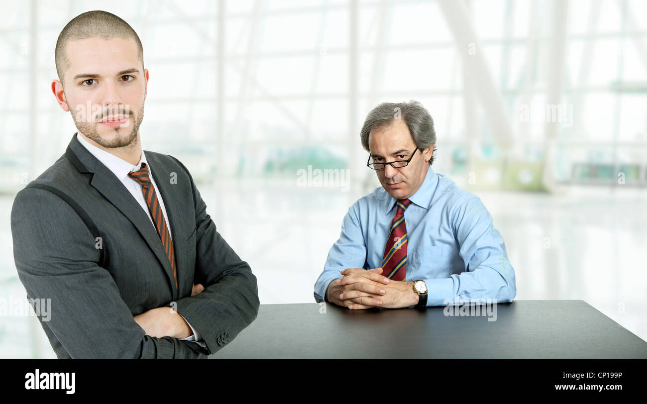 two business men on a desk at the office Stock Photo - Alamy