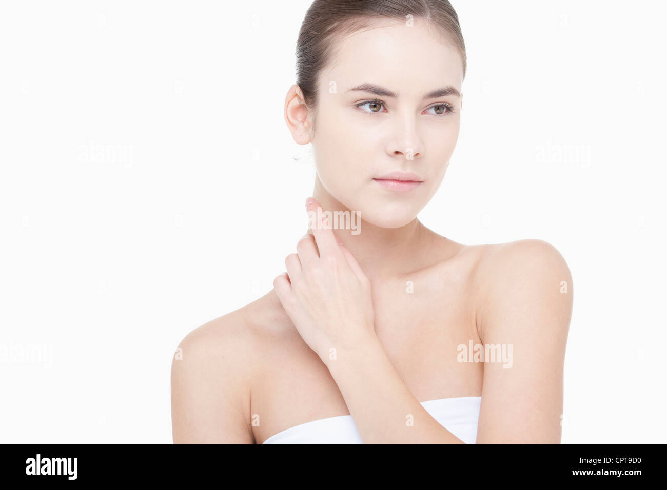 A woman touching her neck Stock Photo - Alamy