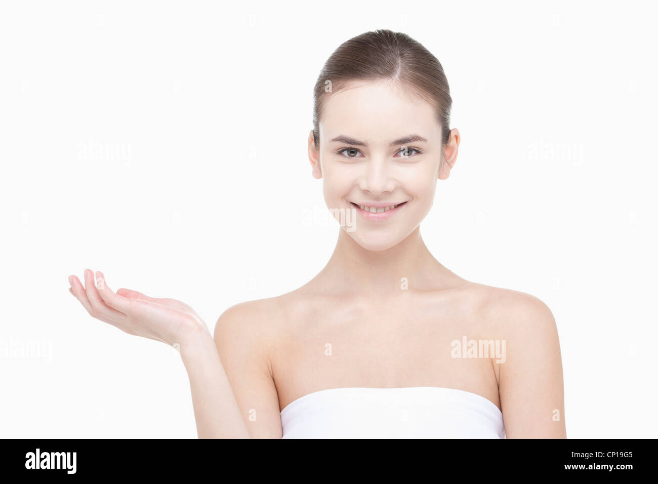 A woman presenting with her hand Stock Photo - Alamy