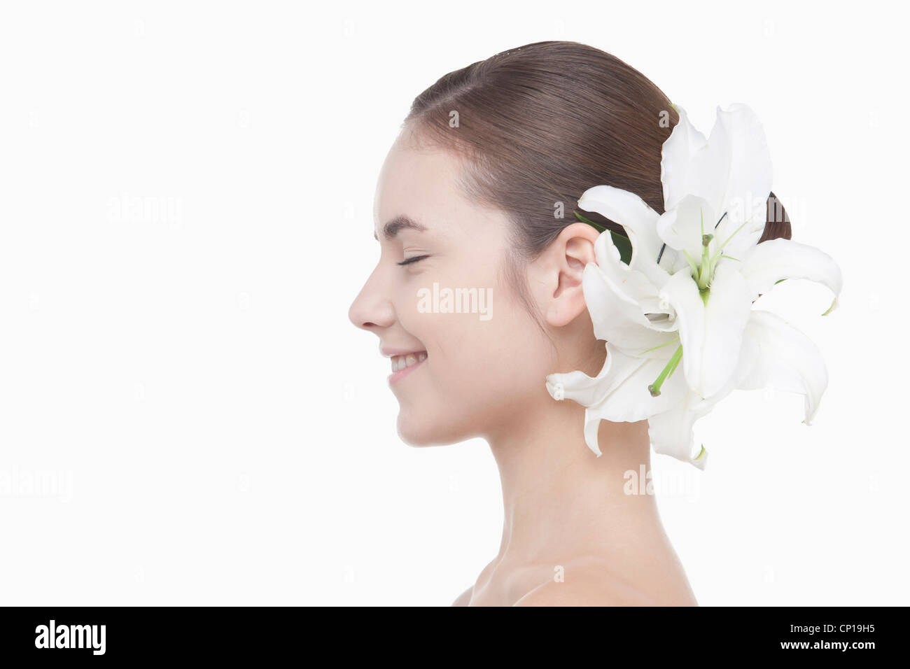 A woman having flowers on her head Stock Photo - Alamy