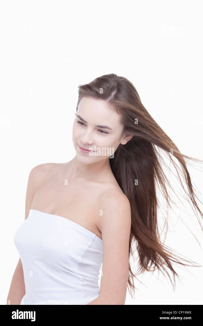 A woman with wind-blown hair Stock Photo - Alamy