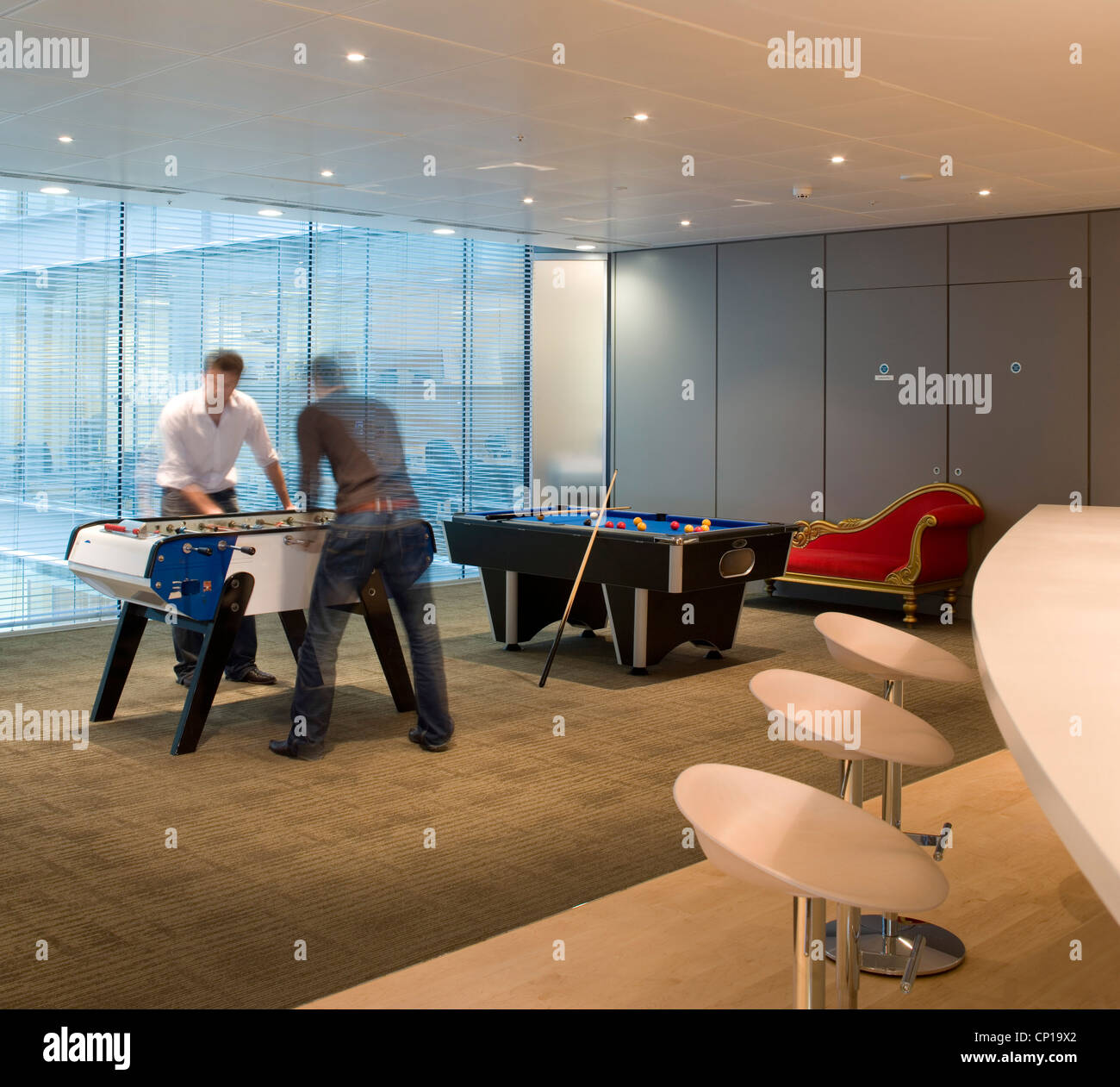 Men play table football in Draftfcb Offices, 80 Victoria Street, London ...