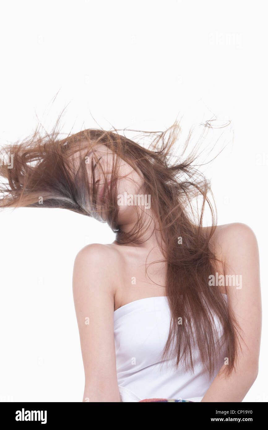 A woman with wind-blown hair Stock Photo - Alamy