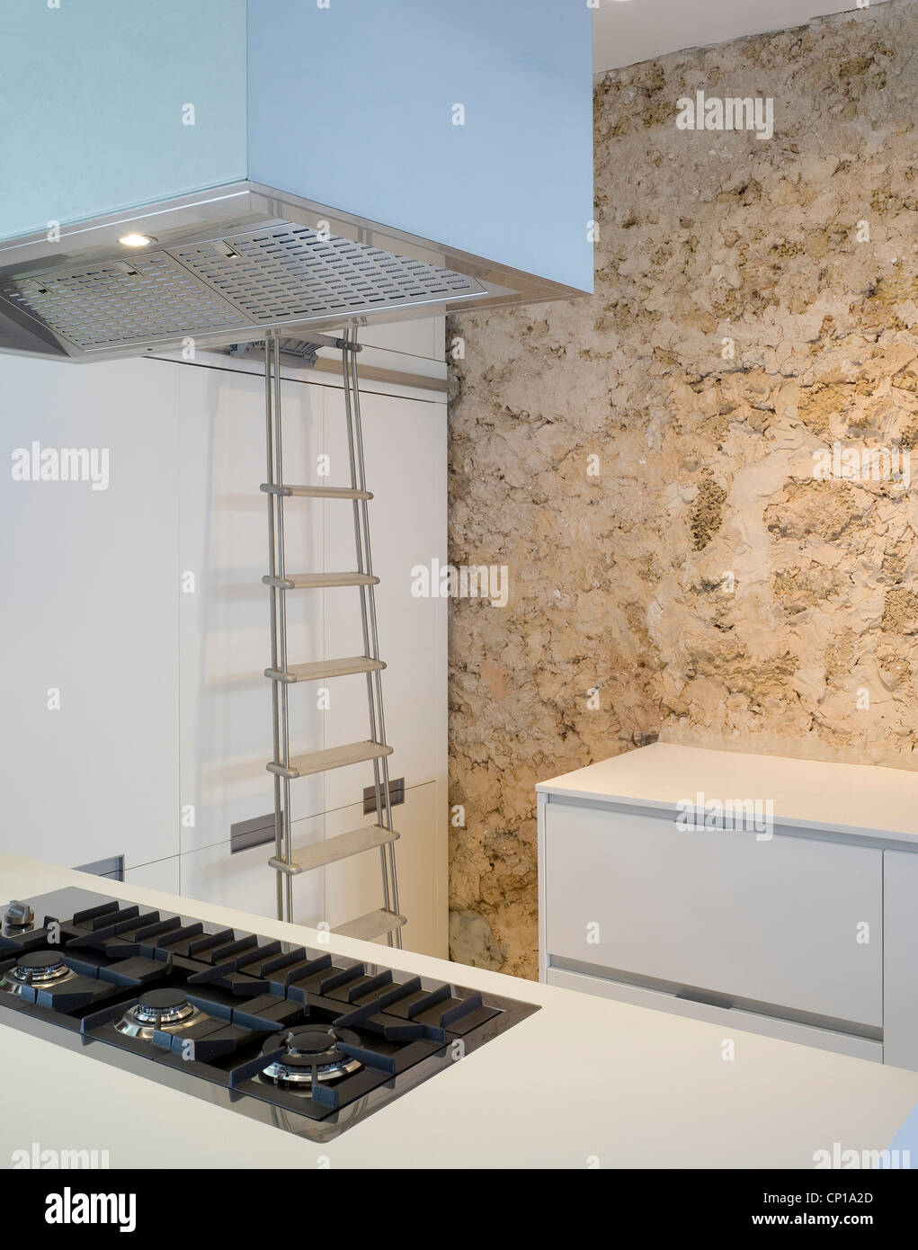 Kitchen with exposed stone wall and ladder Stock Photo - Alamy