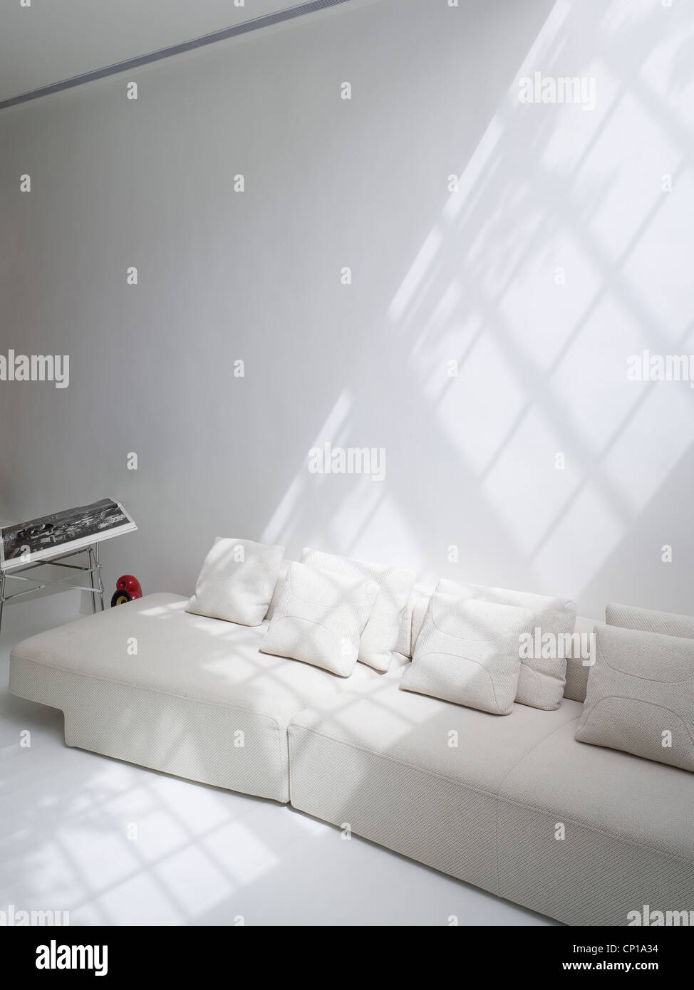 Modern white living room with high-level windows Stock Photo - Alamy