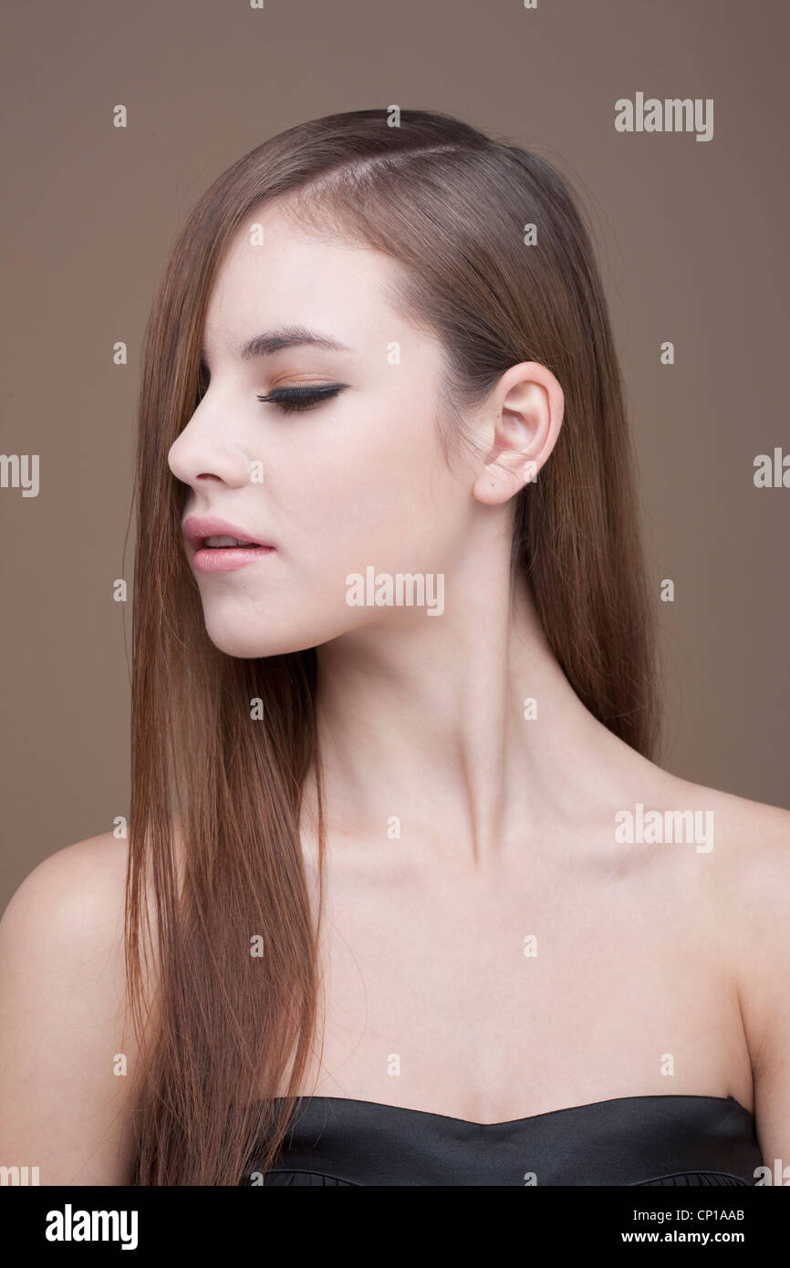 A woman covering her face with hair Stock Photo - Alamy