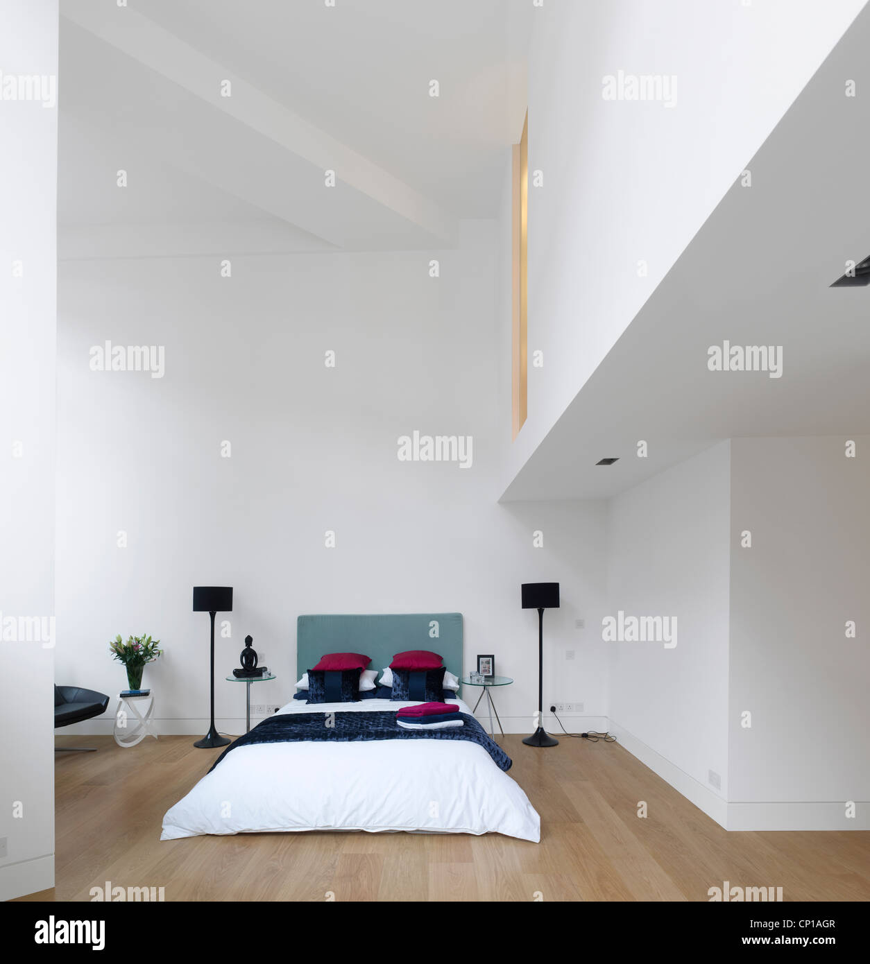 Bedroom of apartment in converted Royal Mail Sorting Office, London, UK ...