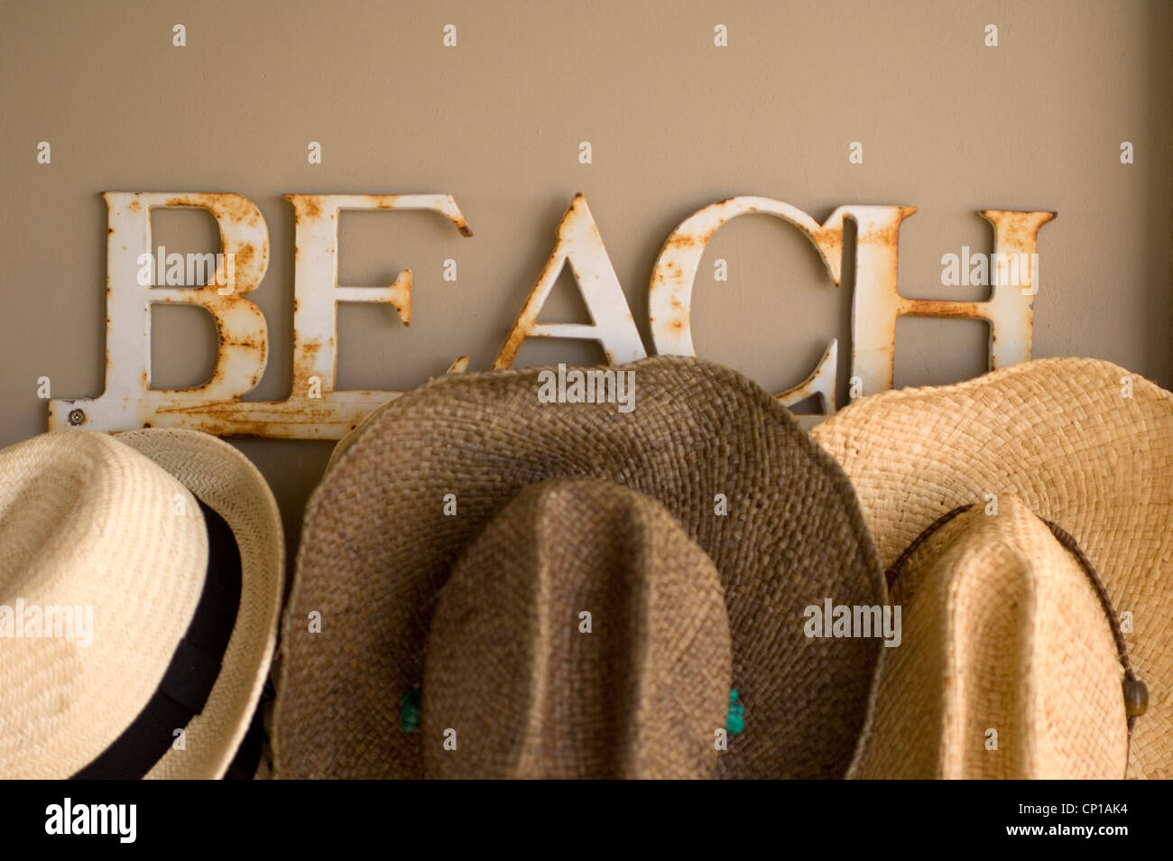 Beach sign and straw hats Stock Photo - Alamy