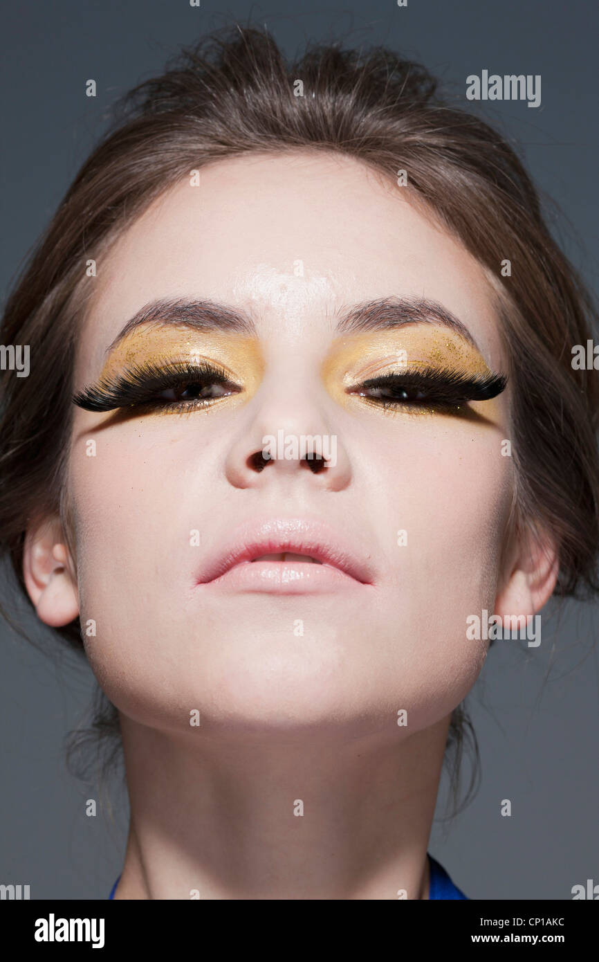 A woman with yellow and long eyelash make-up Stock Photo - Alamy