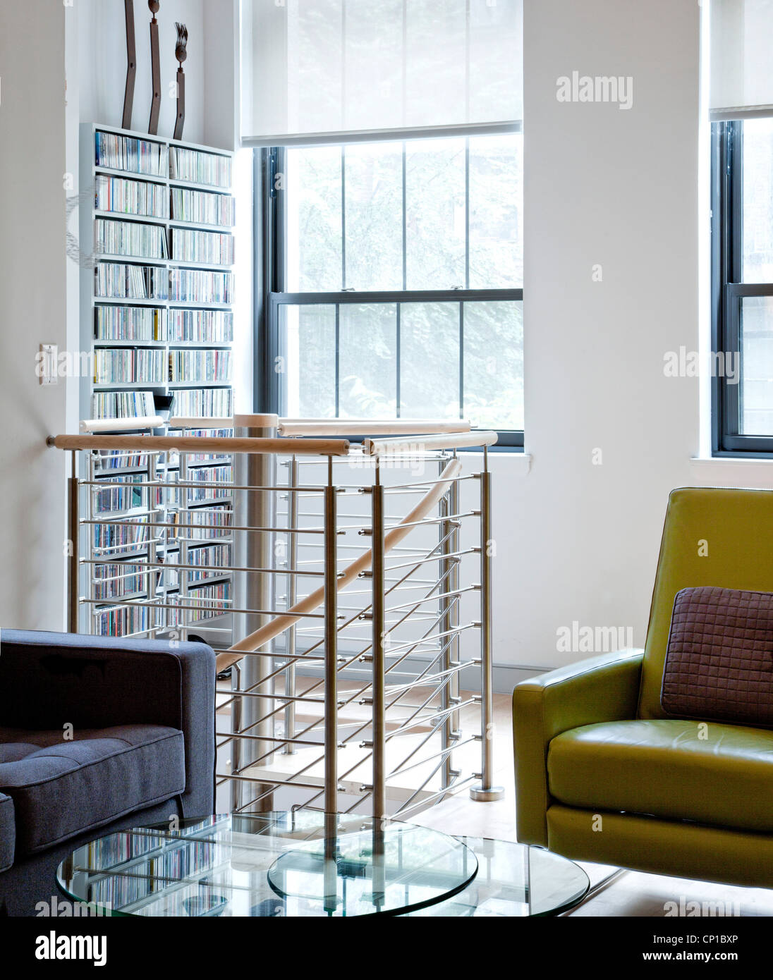 Spiral staircase and CD storage in New York apartment, USA Stock Photo ...