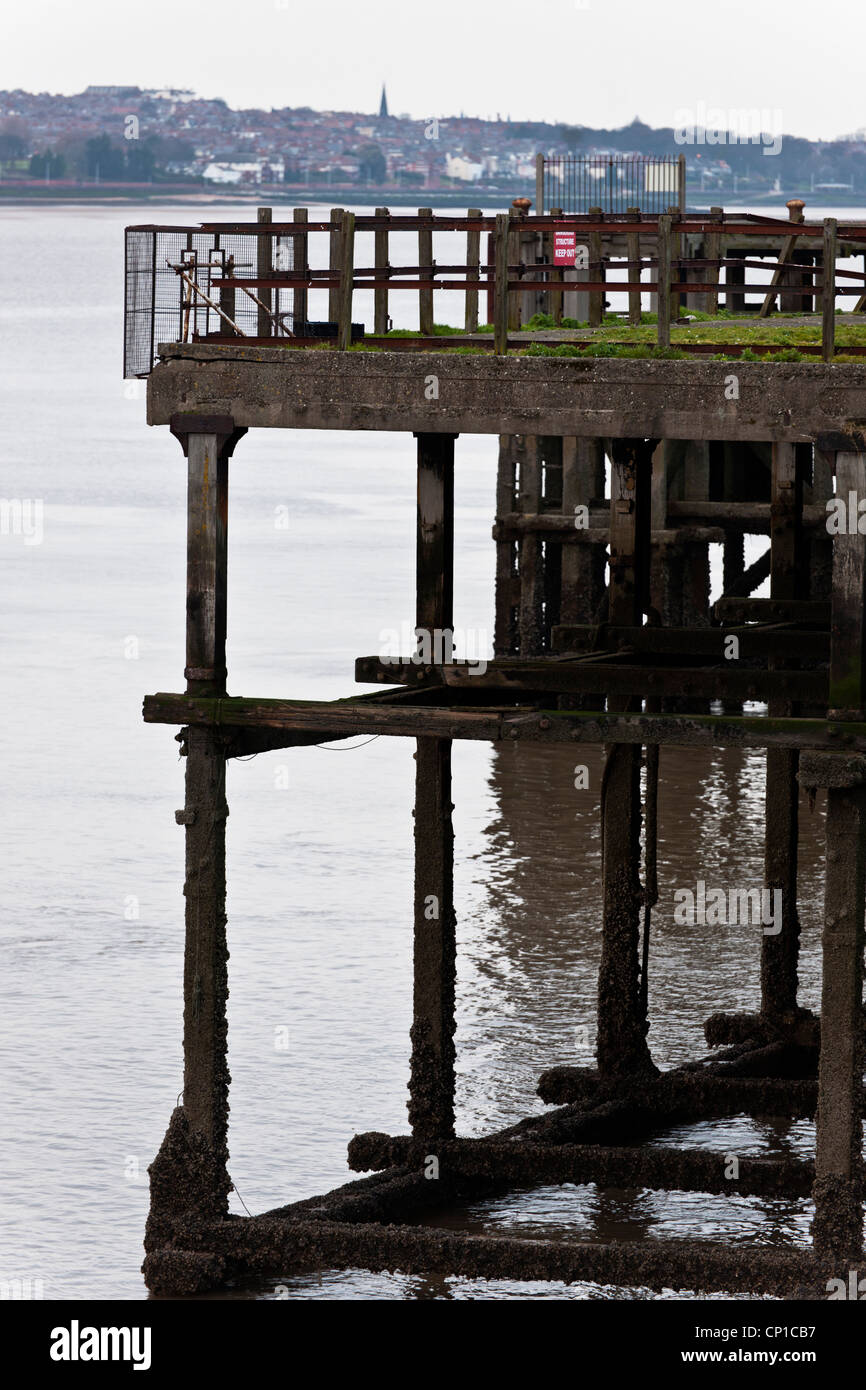 Old concrete pier structure in the docks by the side of the River ...