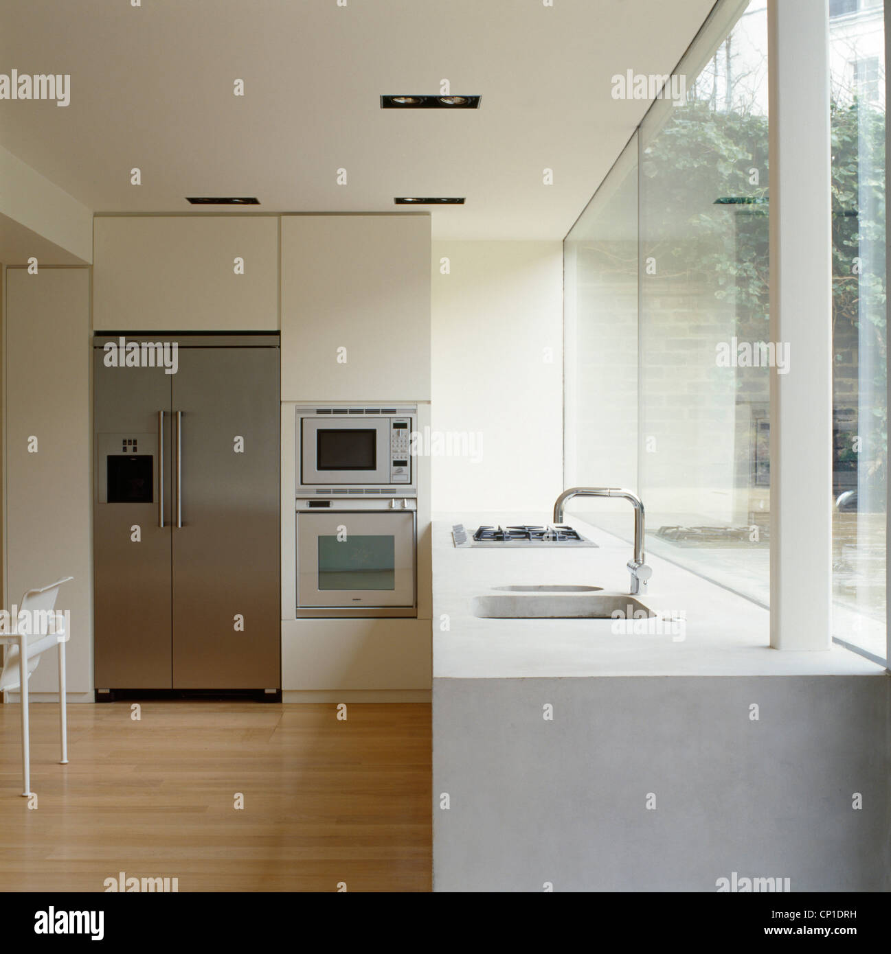 Modern kitchen with white fitted units Stock Photo - Alamy