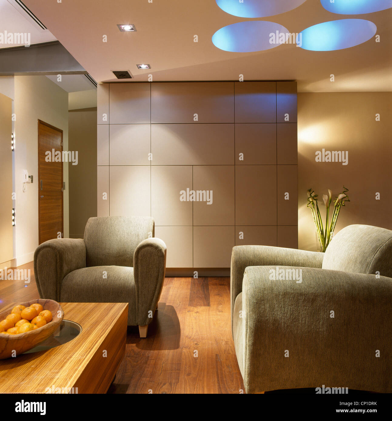 Upholstered seating around coffee table in modern sitting room Stock ...