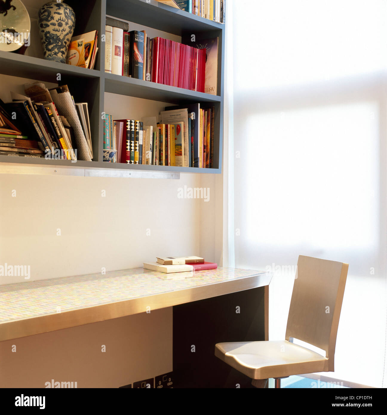 Chair at fitted desk unit in modern room Stock Photo - Alamy
