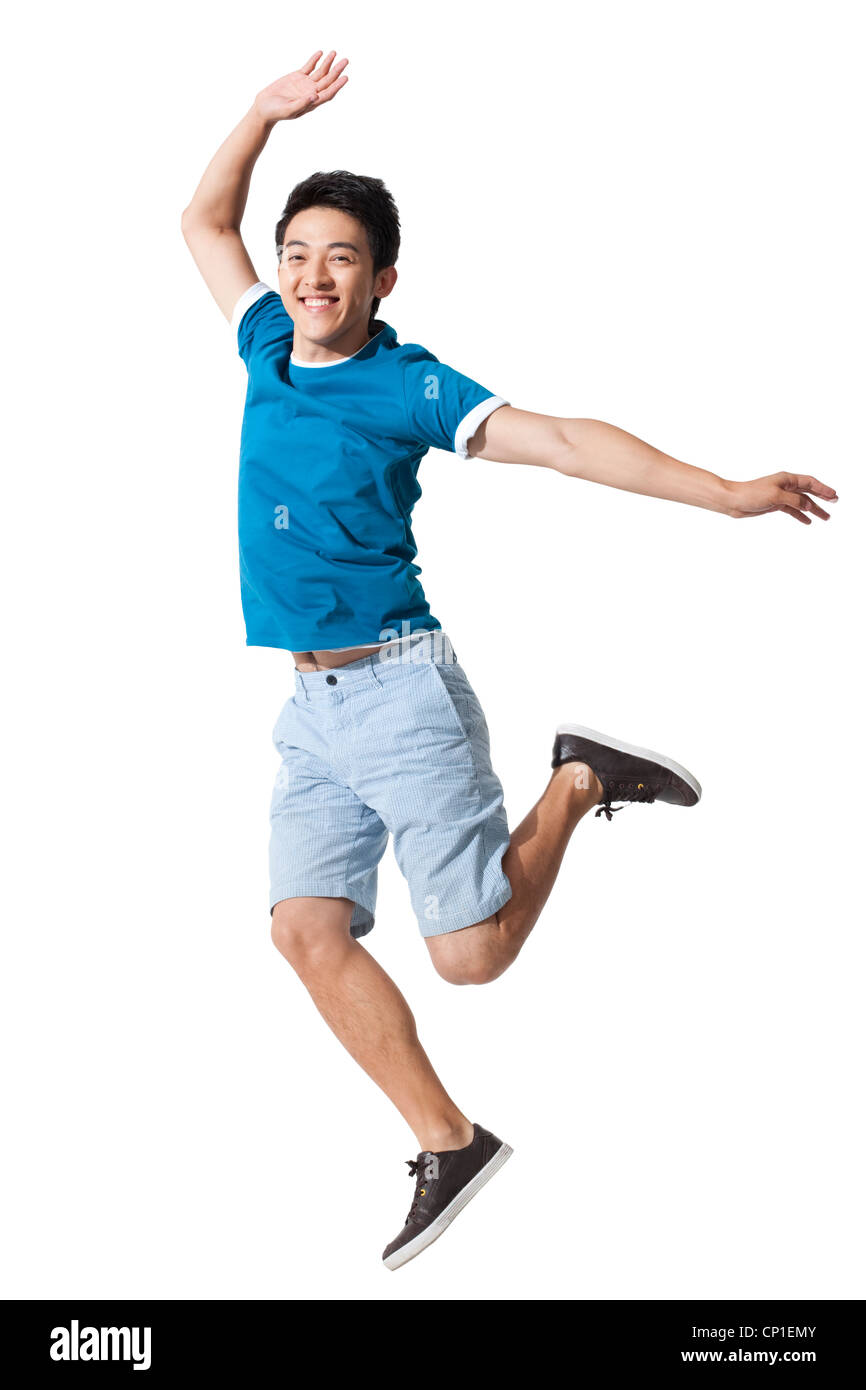 Young man jumping in mid-air Stock Photo - Alamy