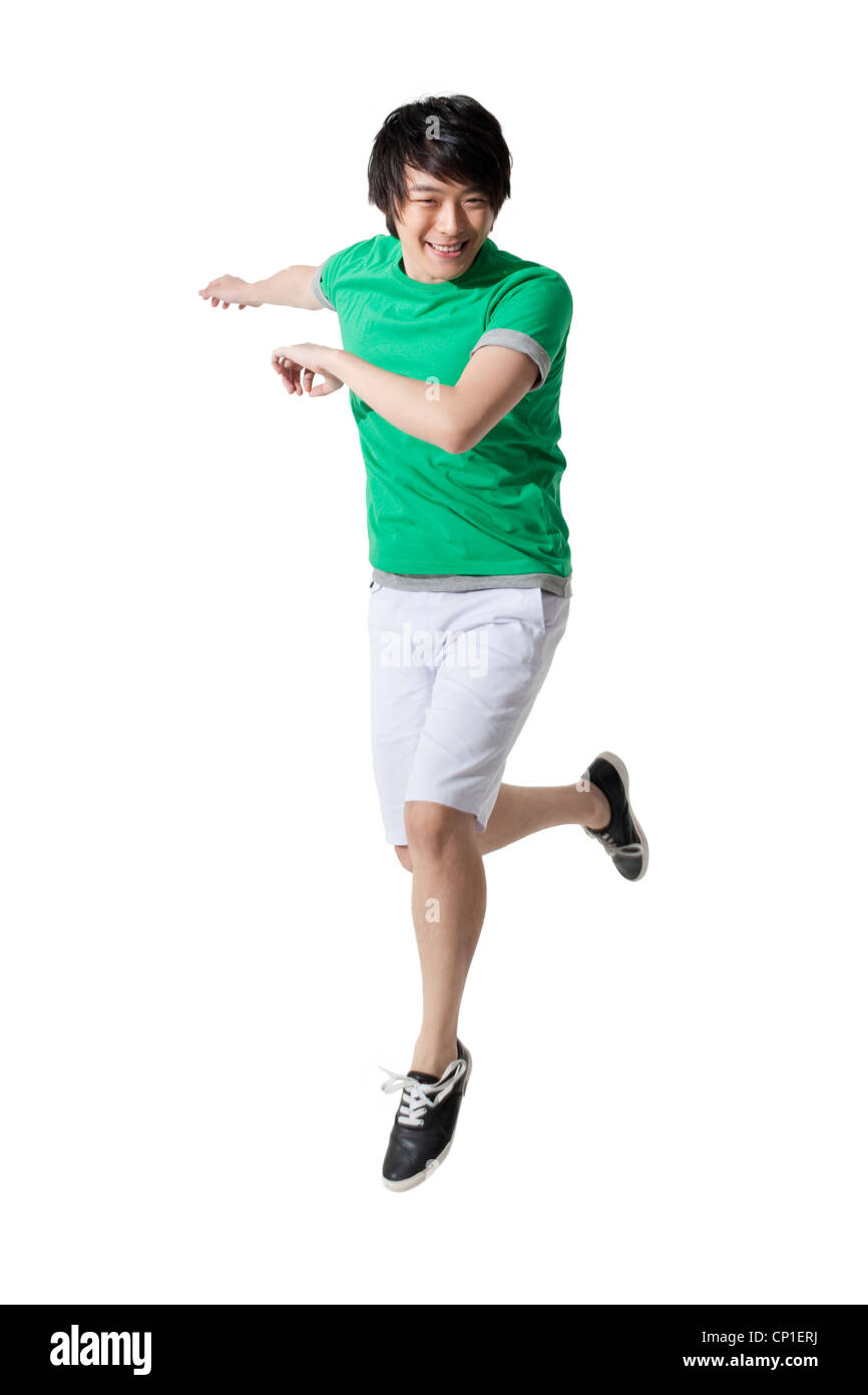 Young man jumping in mid-air Stock Photo - Alamy