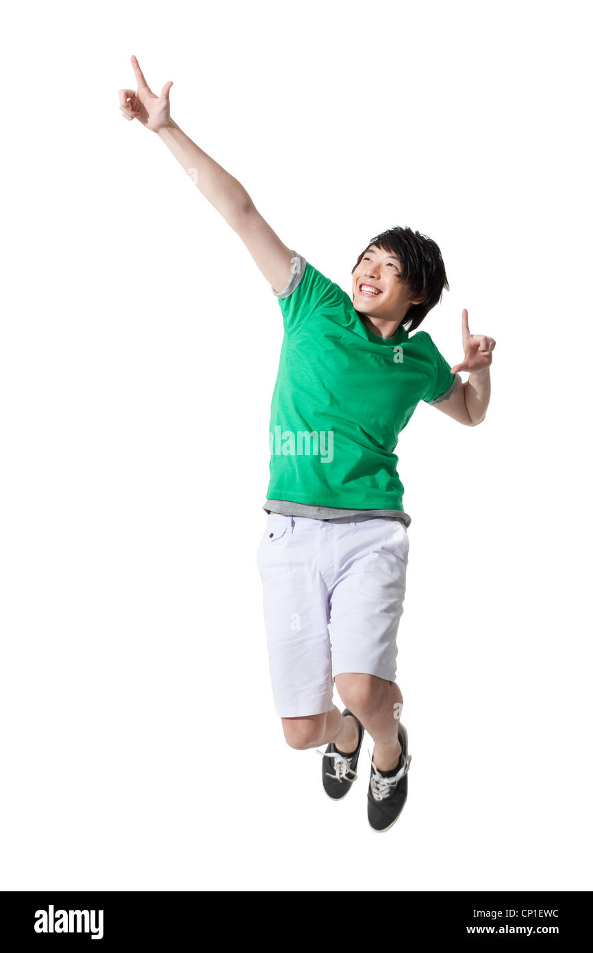 Young man jumping in mid-air Stock Photo - Alamy