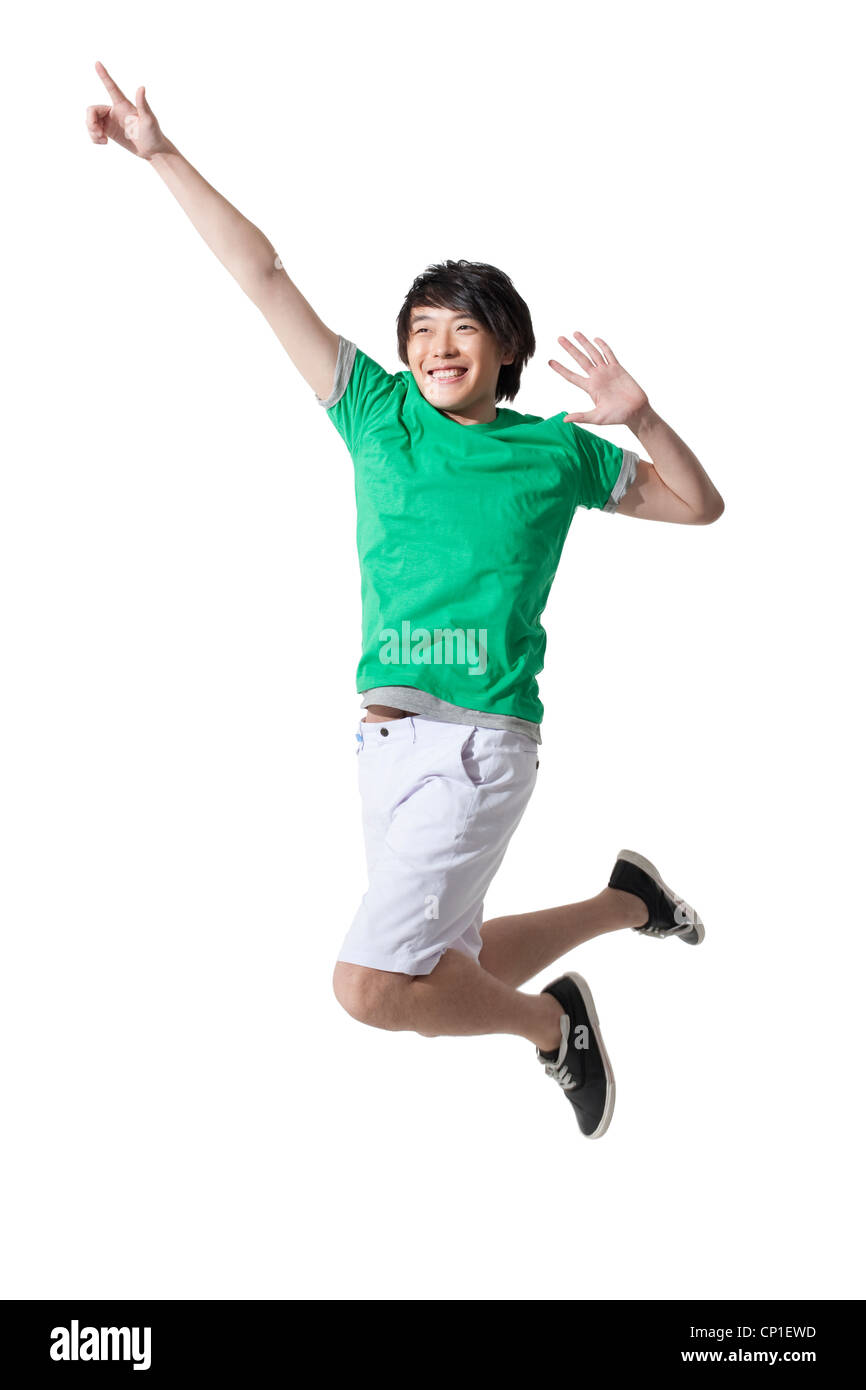 Young man jumping in mid-air Stock Photo - Alamy