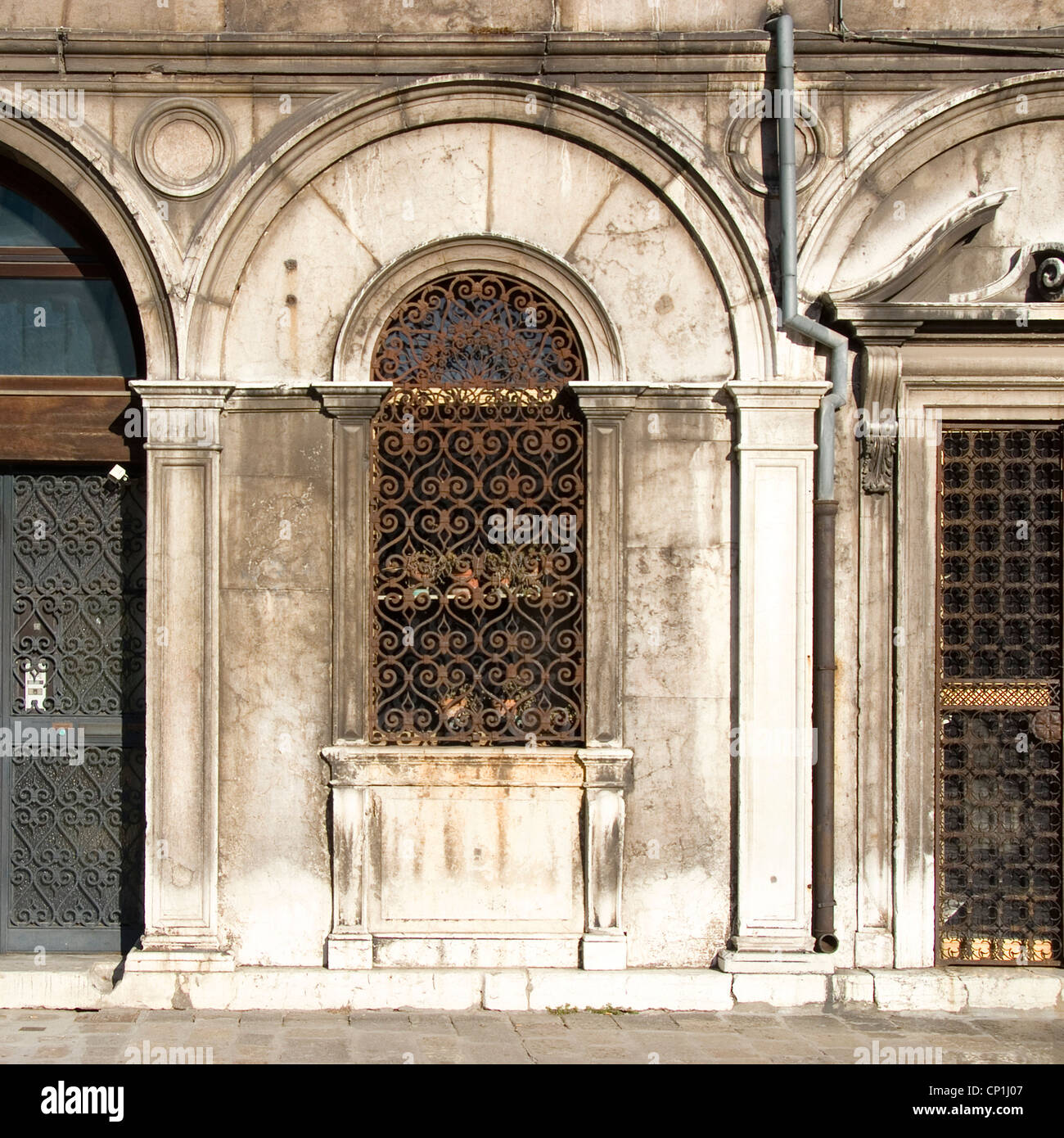 Venice Architectural Detail. Arched doorways with metalworked grille ...