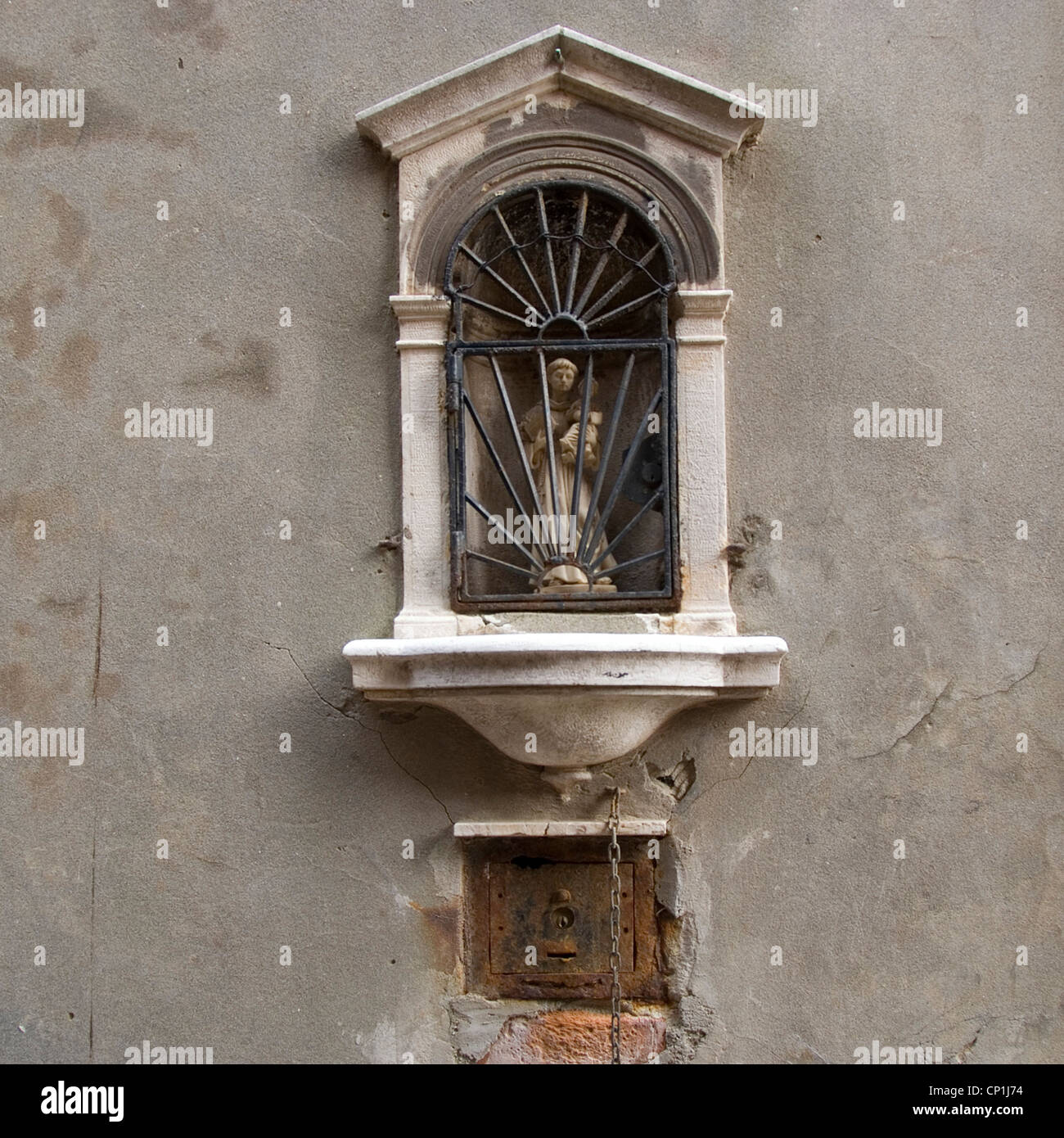 Religious altar on Venice building exterior Stock Photo - Alamy