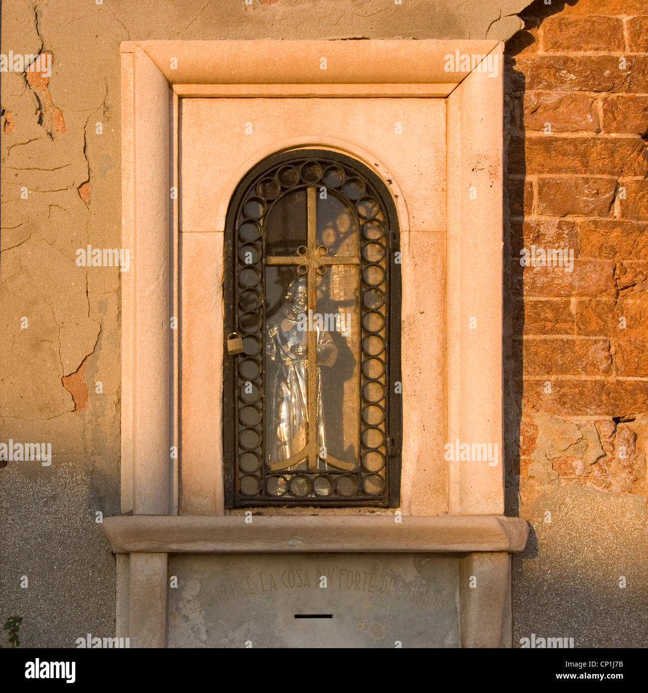 Religious altar on Venice building exterior Stock Photo - Alamy