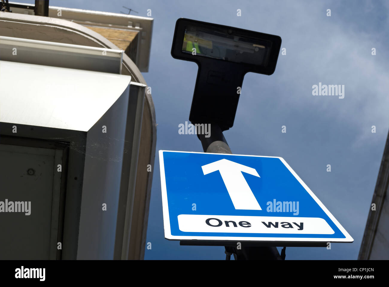 british one way street road sign with arrow and wording Stock Photo - Alamy