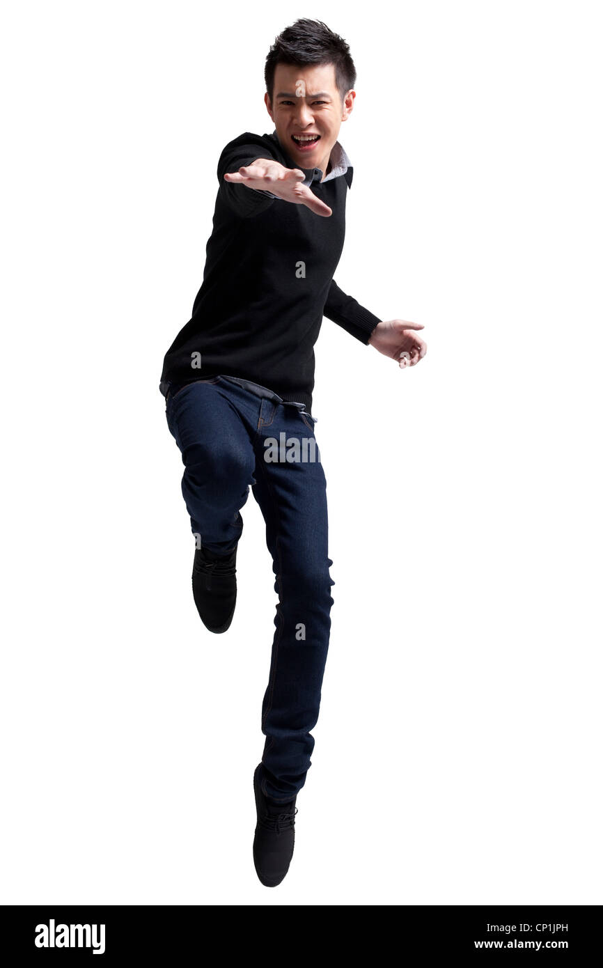 Young man jumping in mid-air Stock Photo - Alamy