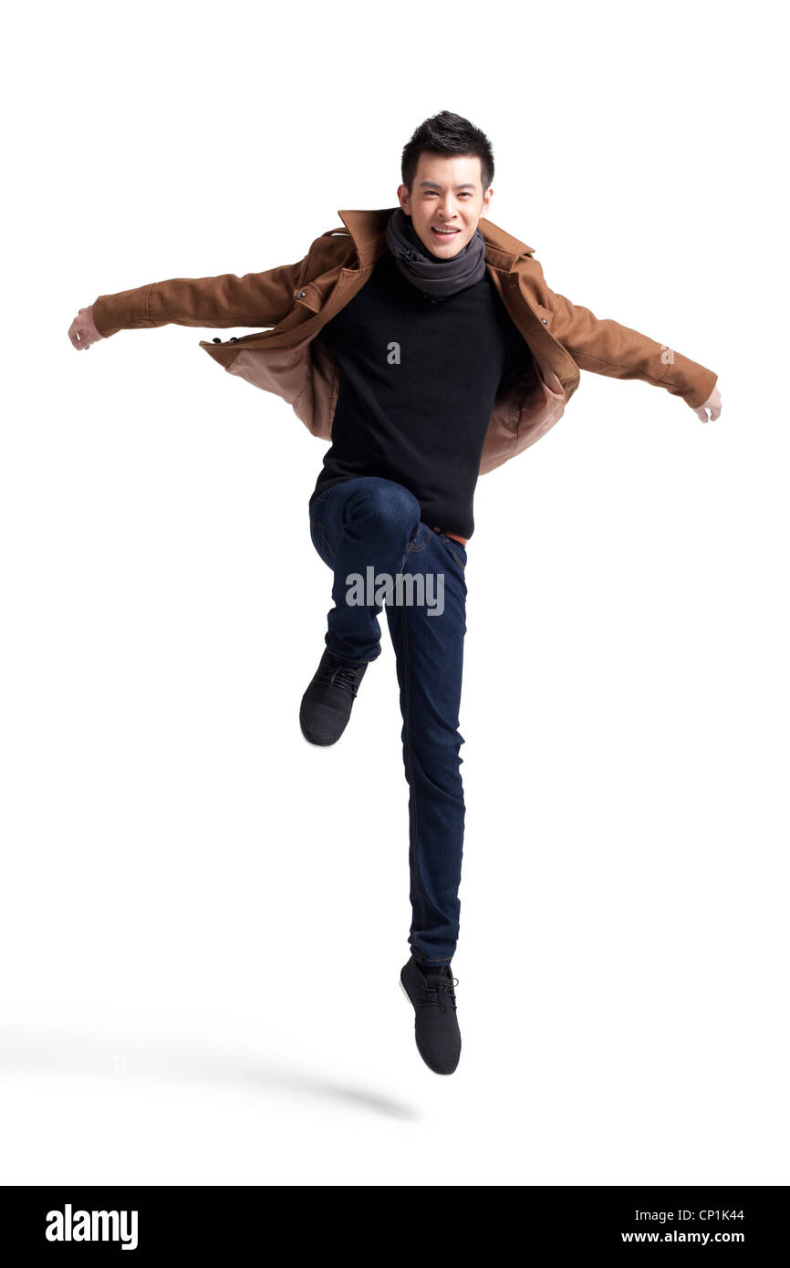Young man jumping in mid-air Stock Photo - Alamy