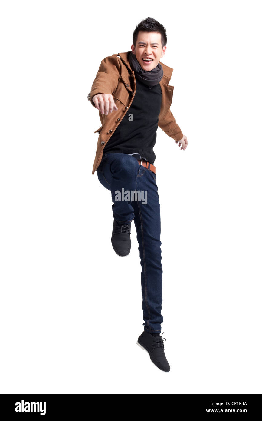 Young man jumping in mid-air Stock Photo - Alamy