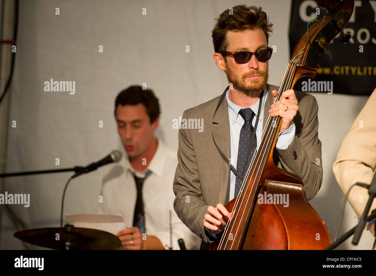Man playing string bass and band on stage Stock Photo - Alamy