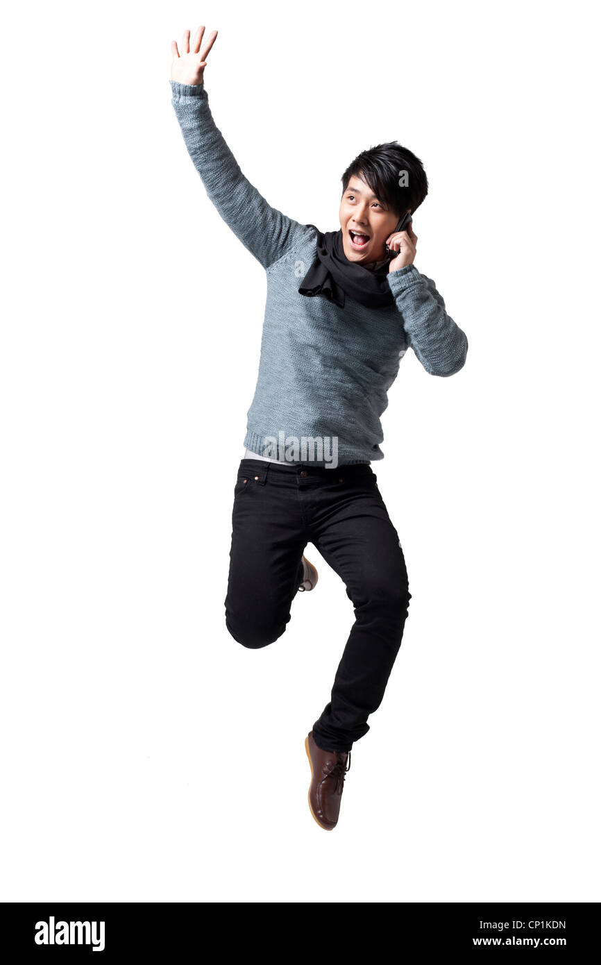 Young man using mobile phone Stock Photo - Alamy