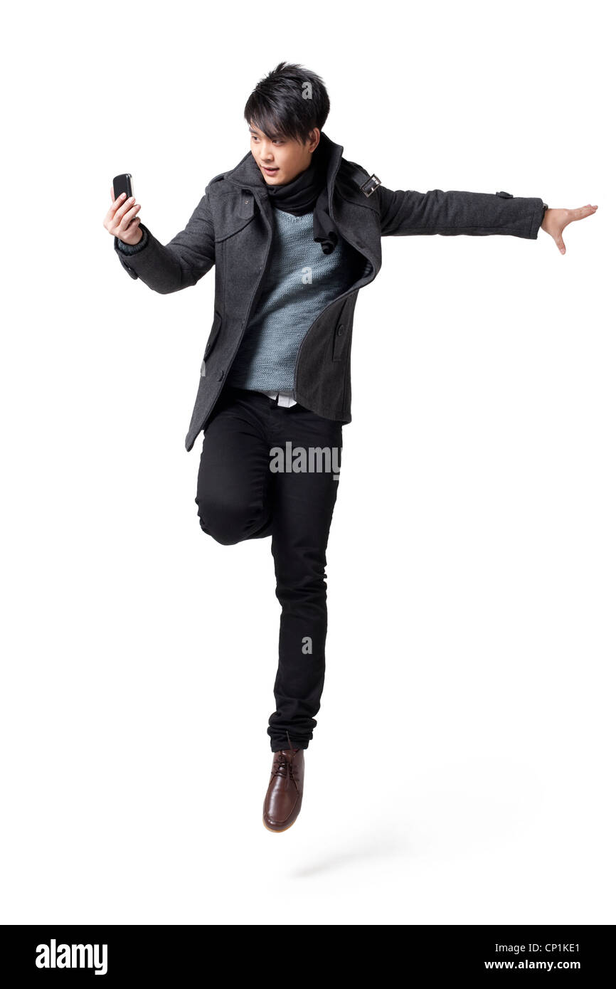 Young man using mobile phone Stock Photo - Alamy