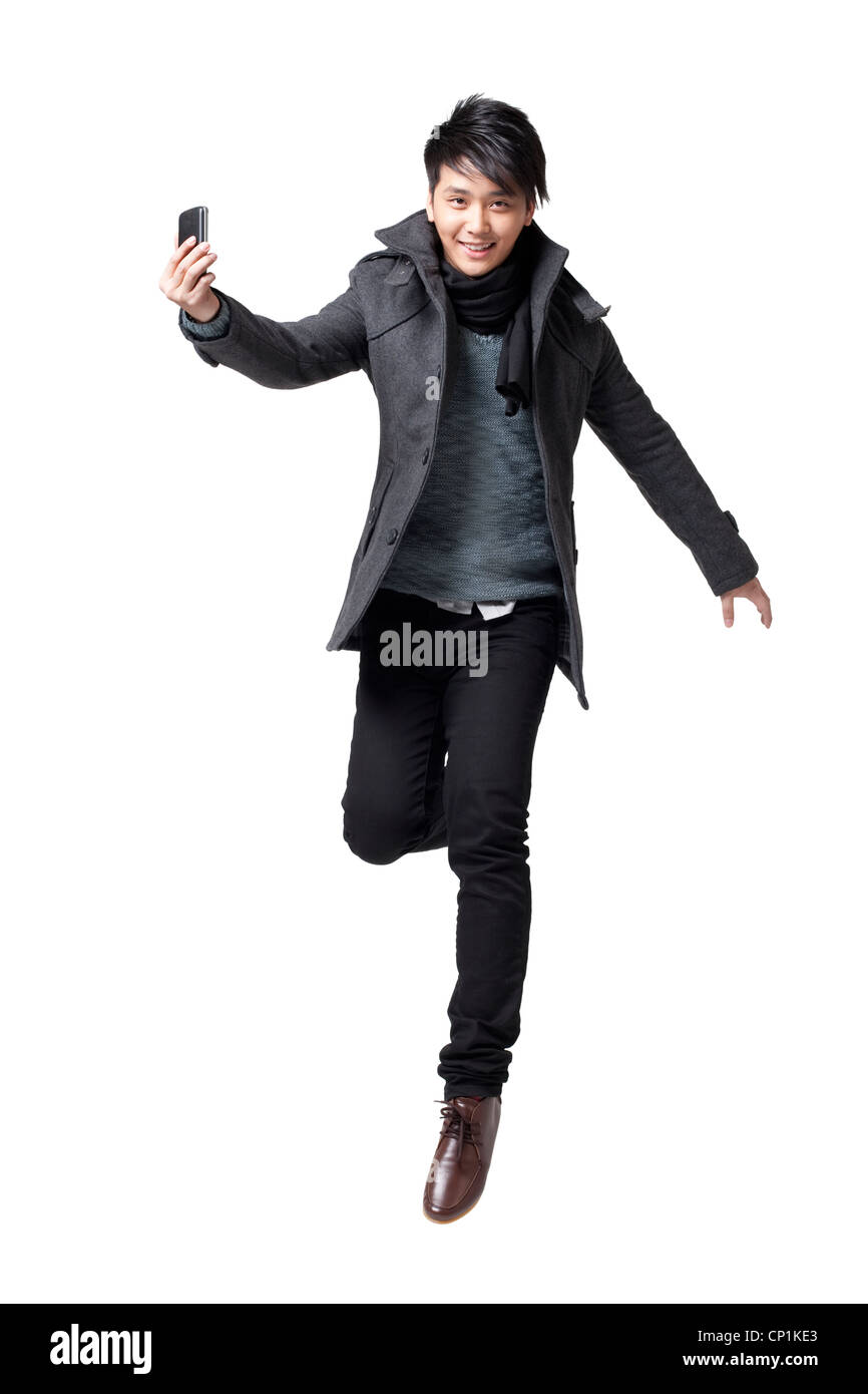 Young man showing mobile phone Stock Photo - Alamy