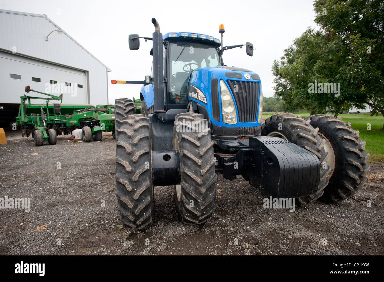 Tractors and machinery on a farm Stock Photo - Alamy