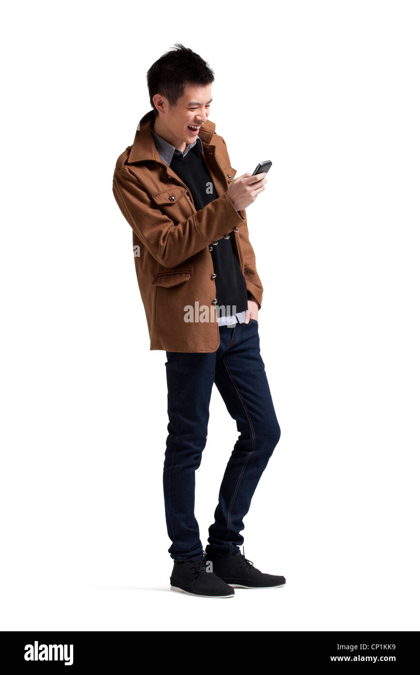 Young man using mobile phone Stock Photo - Alamy