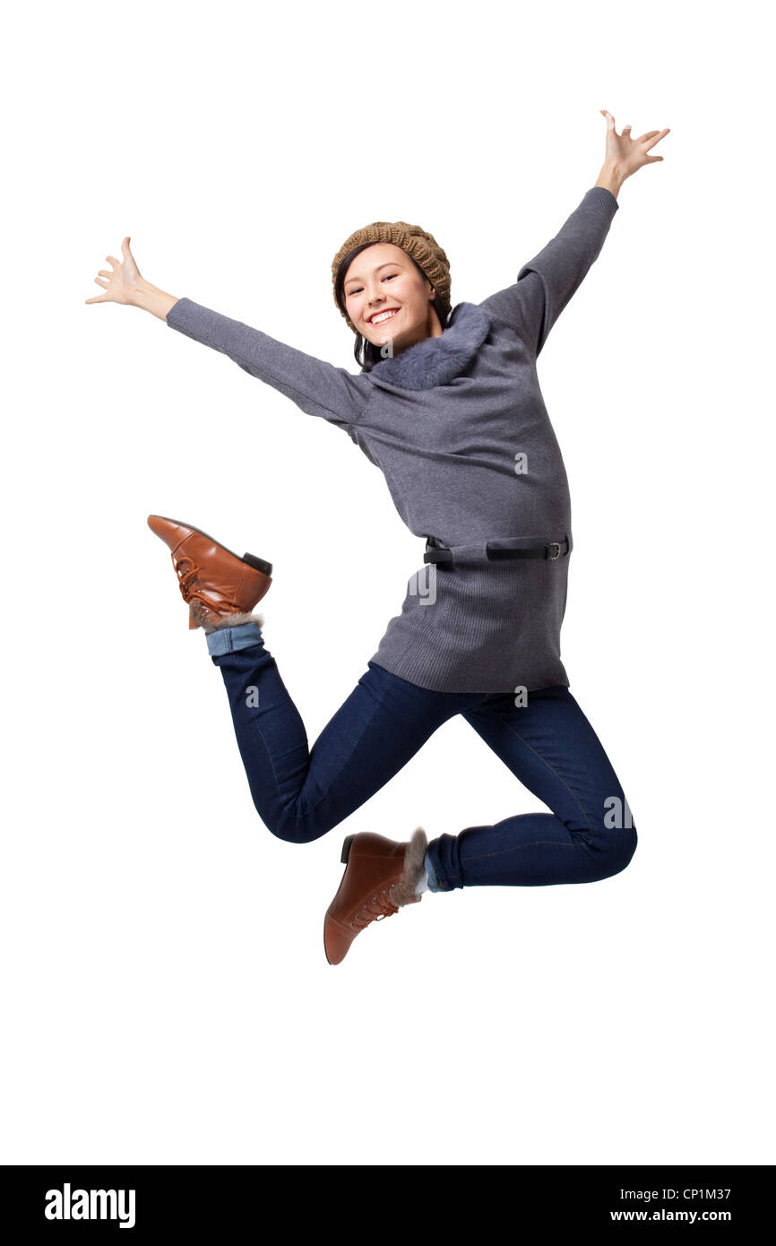 Young woman jumping in mid-air Stock Photo - Alamy