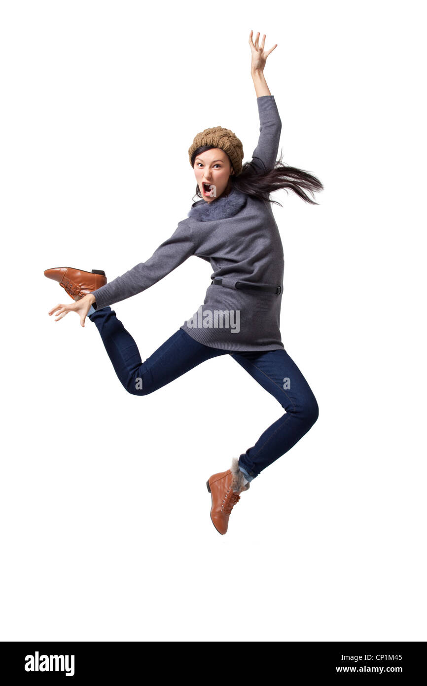 Young woman jumping in mid-air Stock Photo - Alamy