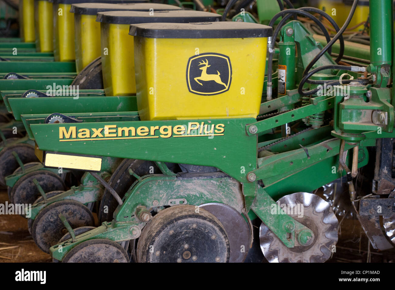 Barn with farming equipment and tractors inside Stock Photo - Alamy